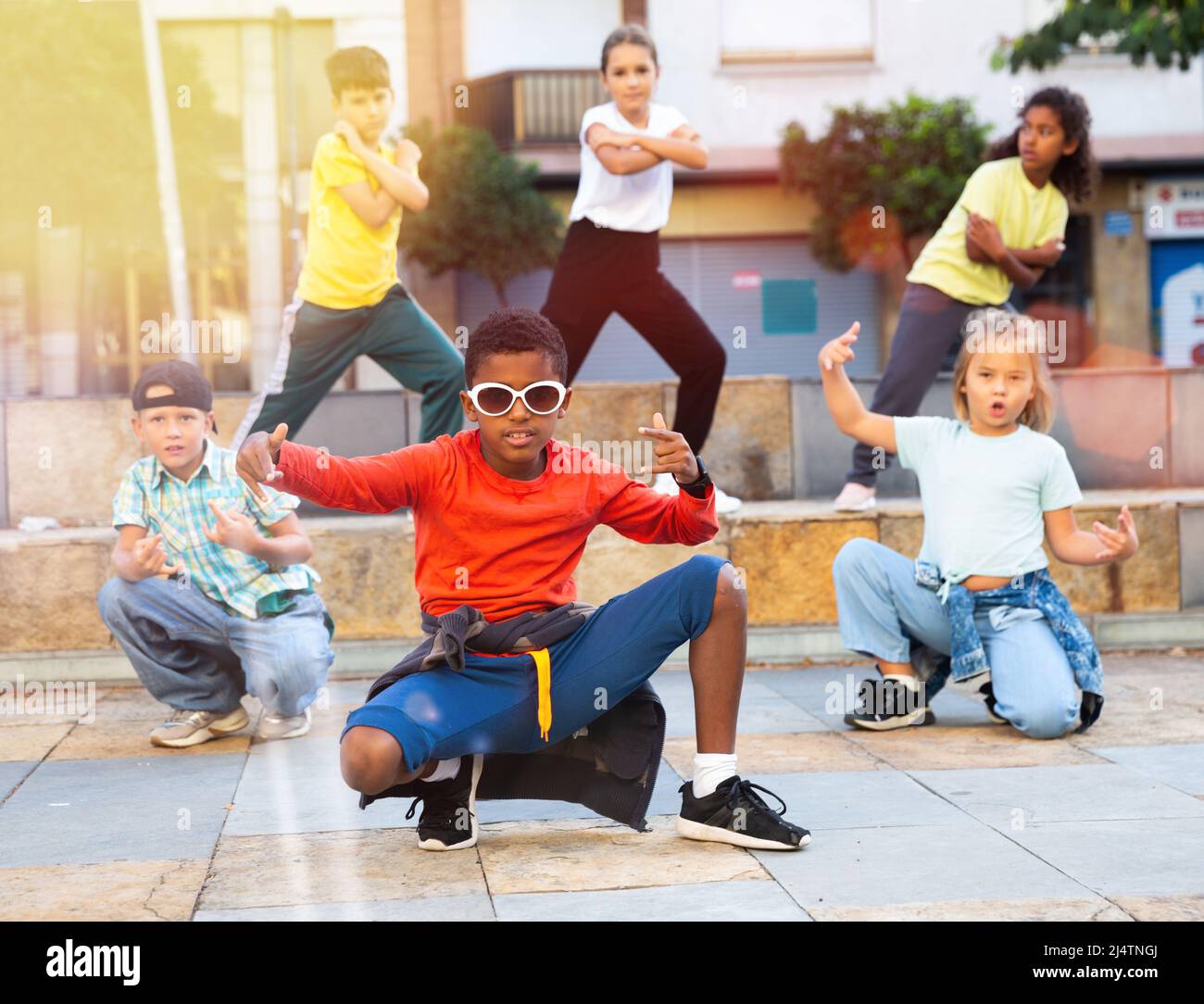 Kids training hip hop on city street Stock Photo - Alamy
