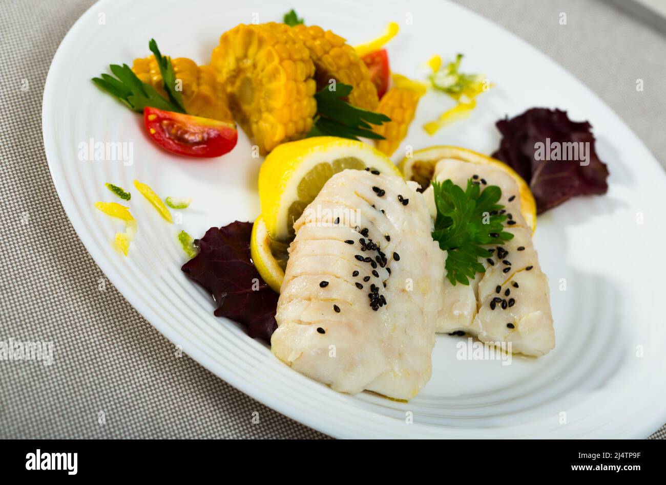 Recipe for steamed hake with vegetables Stock Photo - Alamy