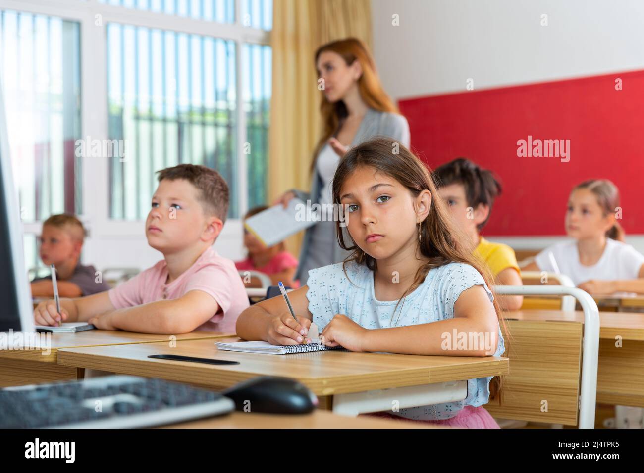 Kids studying in classroom Stock Photo - Alamy
