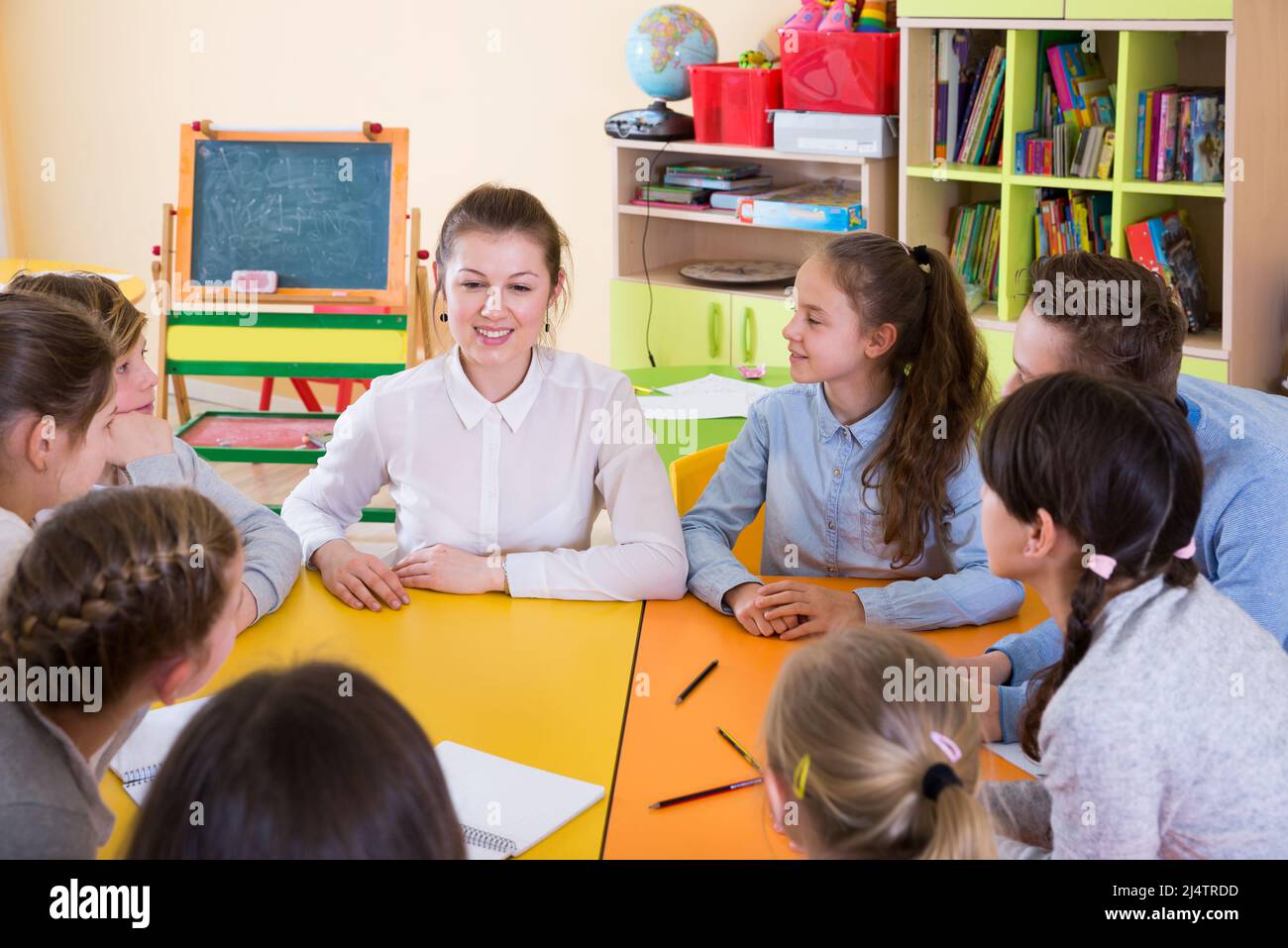 Children teacher school talking table hi-res stock photography and ...