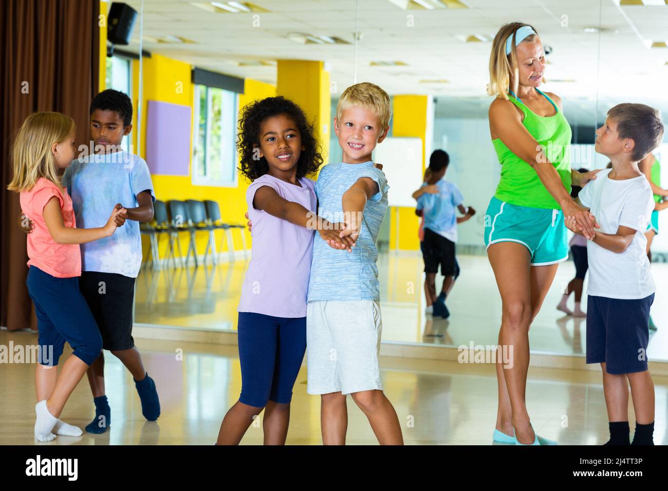 Little boys and girls dancing pair dance in the ballet studio Stock ...