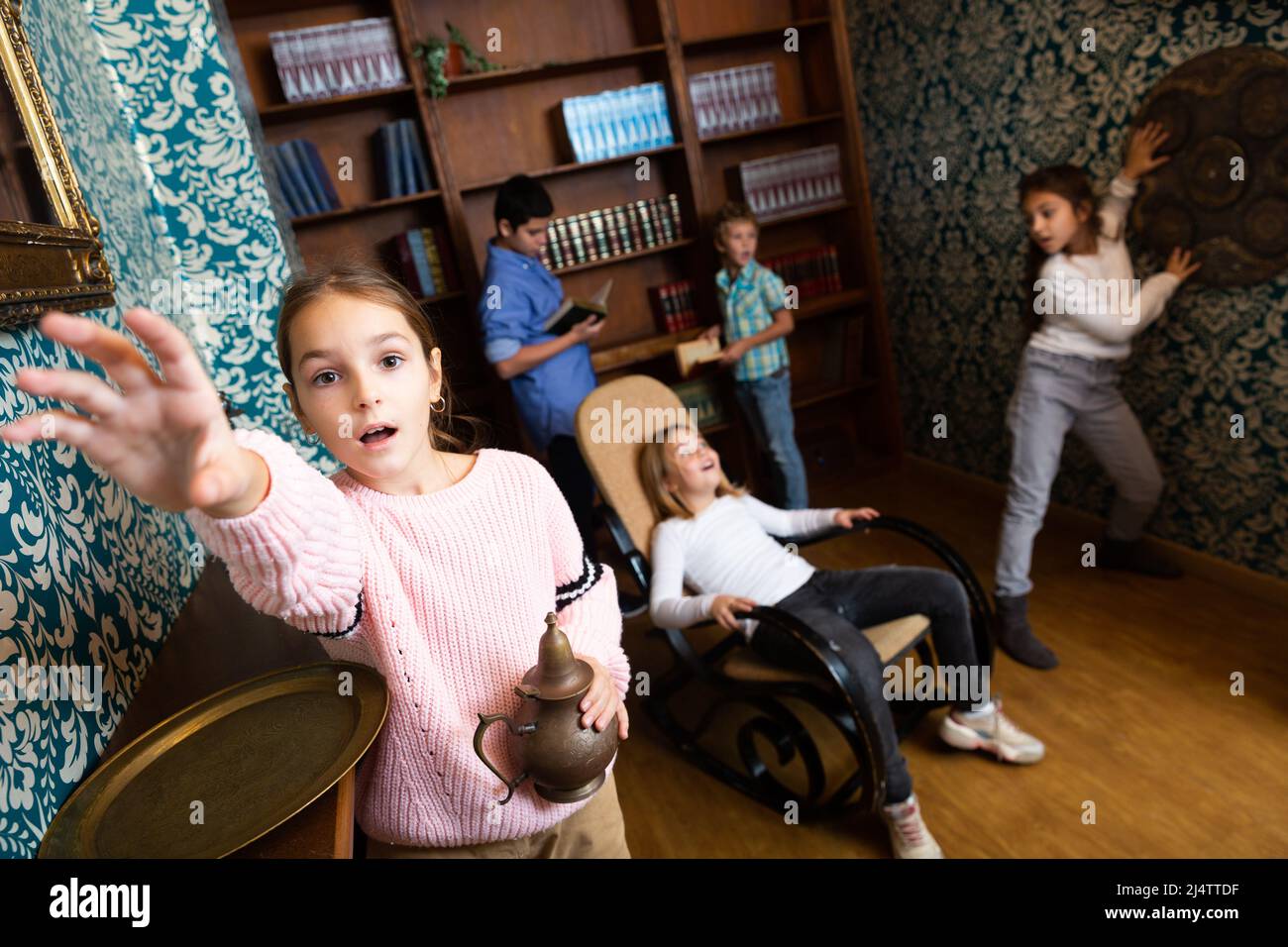 Friends solving different conundrum as detectives in quest room with ...