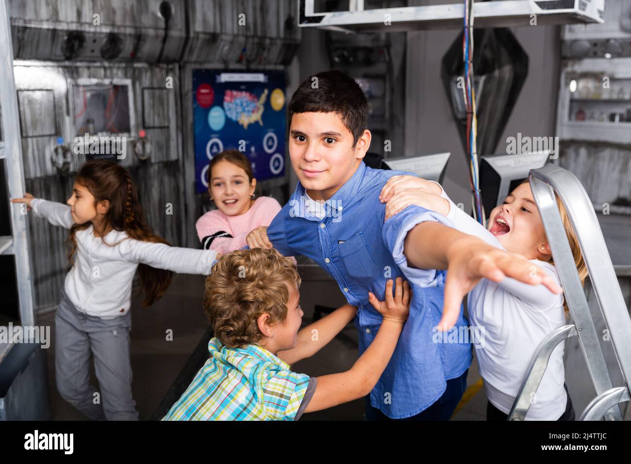 Quest game - children keep a boy turned into zombie Stock Photo - Alamy
