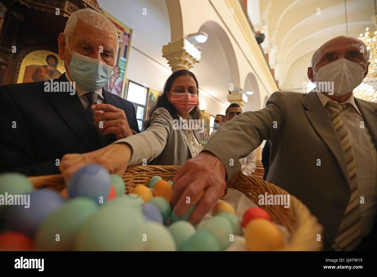 Beirut, Lebanon. 17th Apr, 2022. People pick colored eggs during an ...