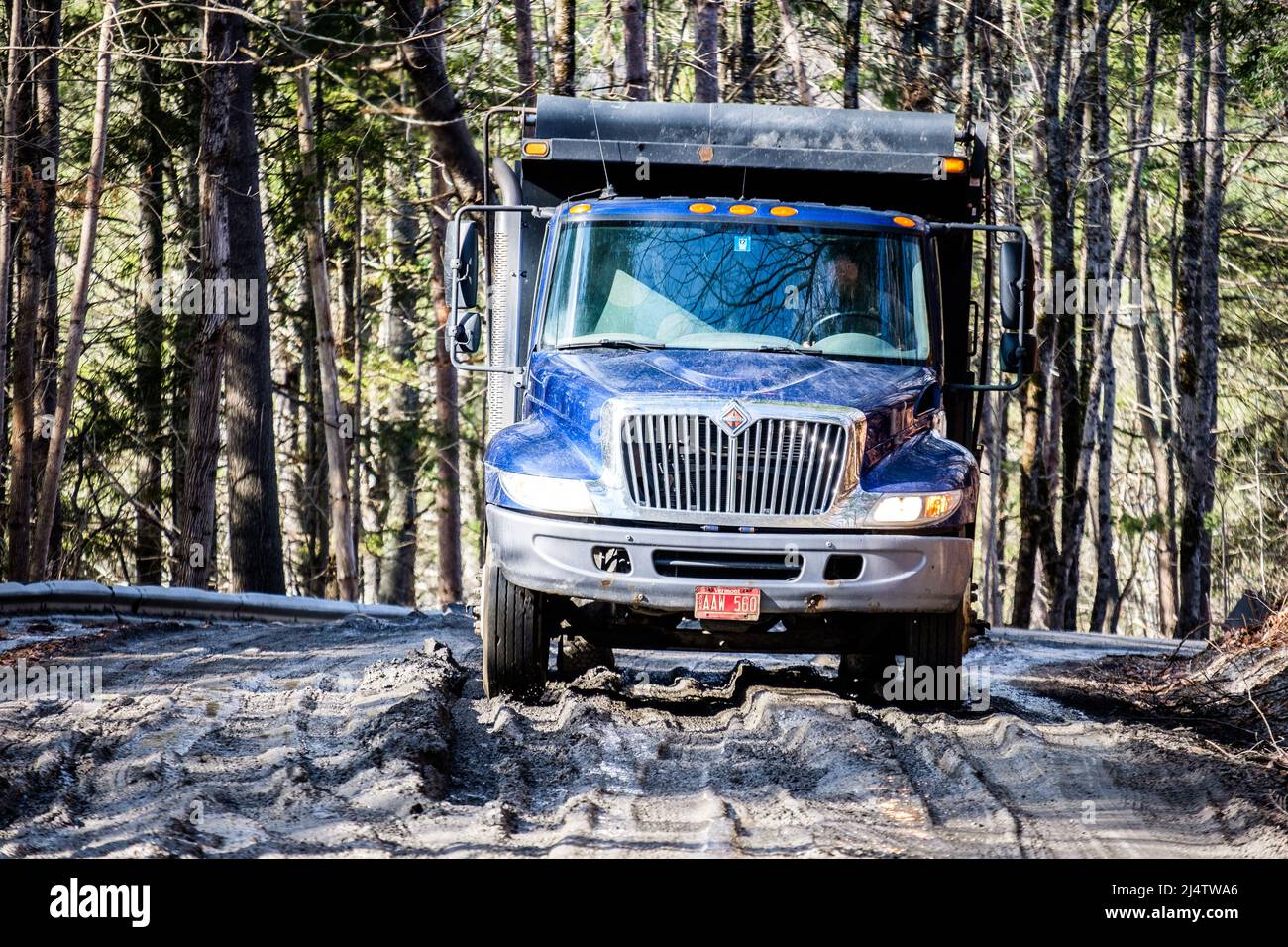 Trucks on muddy roads in Mud Season, the descent of Vermont dirt roads ...