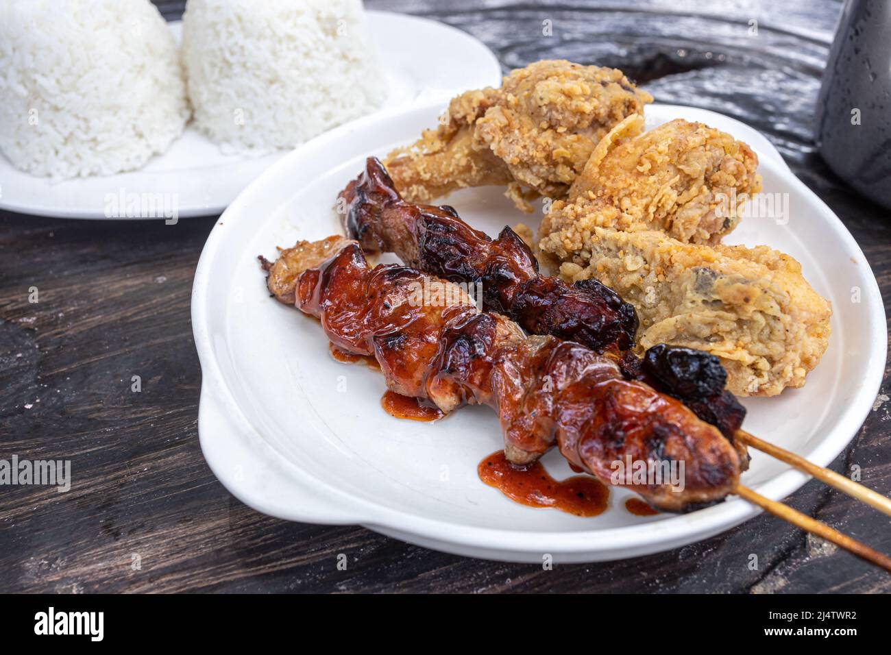 Popular filipino food pork barbeque and fried chicken at restaurant ...