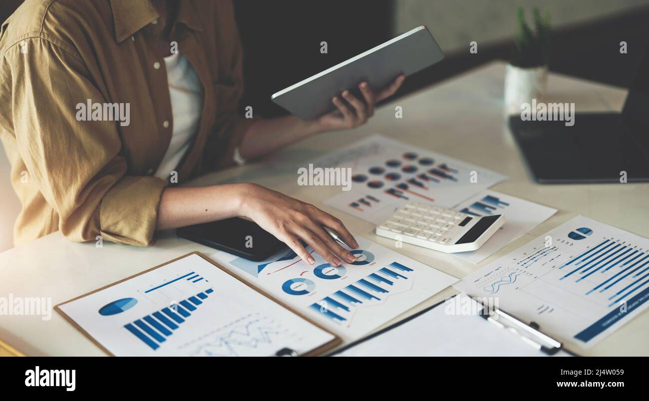 Business or accountant woman analysis turnover with graph chart report ...