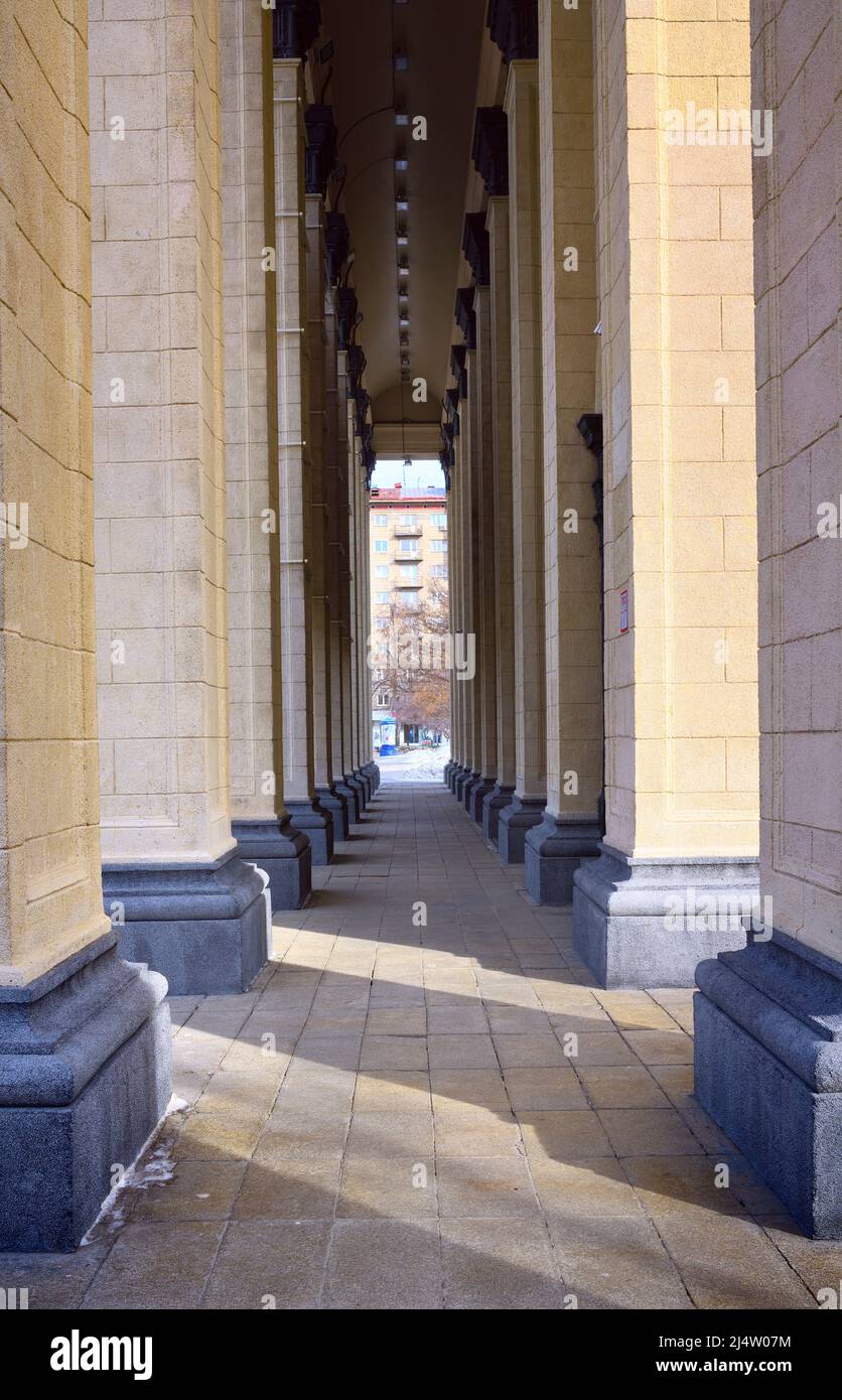 A high colonnade with a stone floor. The entrance portico of the Grand ...