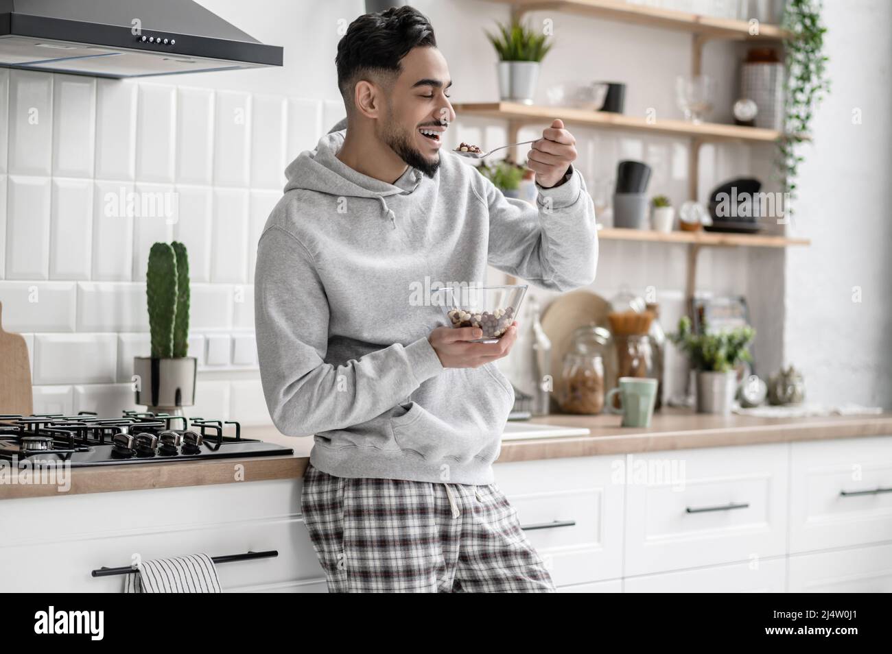 A young man spending morning at home and having coffee Stock Photo - Alamy