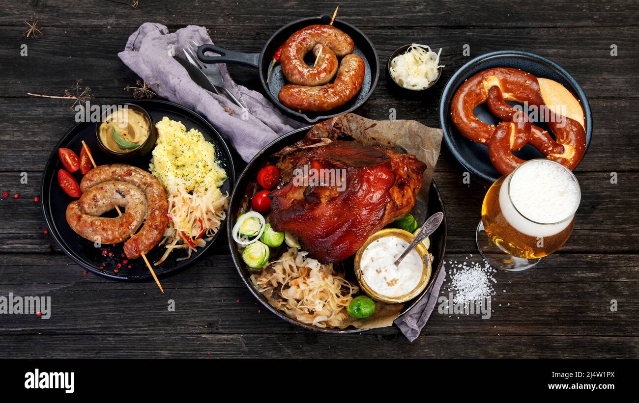 Grilled German sausages on wooden background. Traditional food concept ...