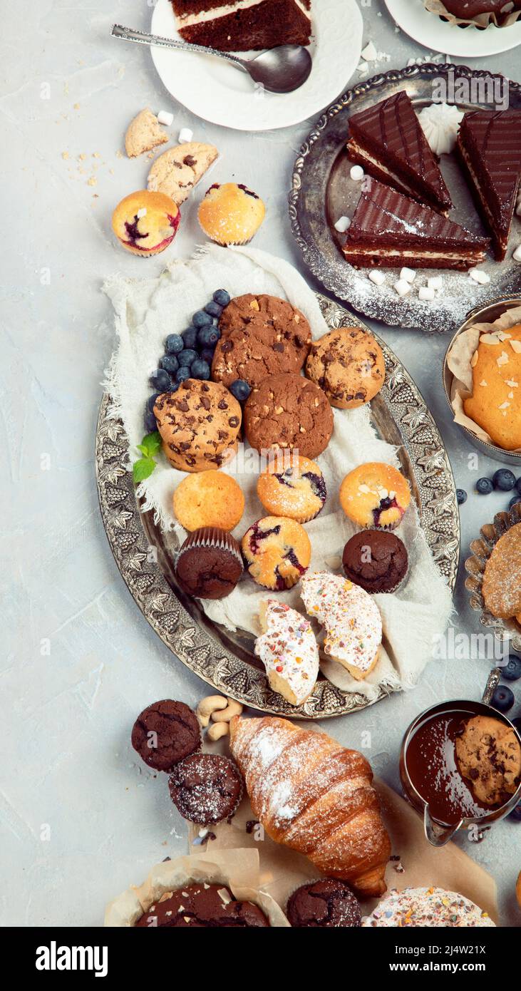 Dessert table with all kinds snacks on light background. Candy bar ...