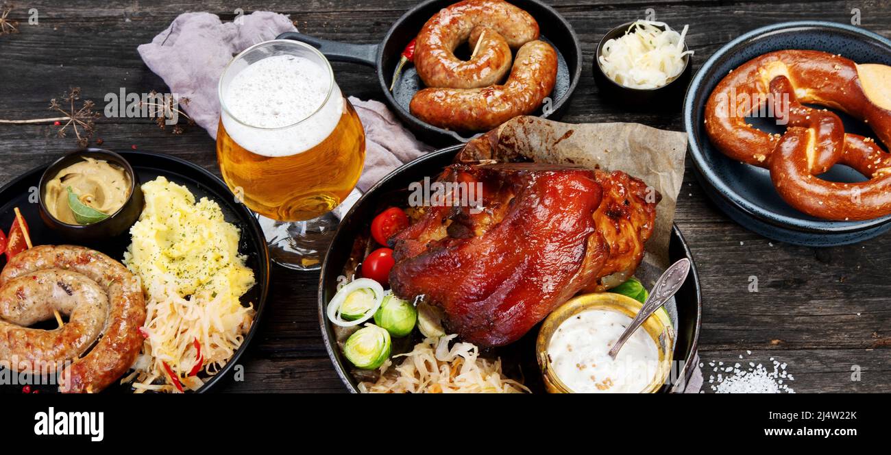 Grilled German sausages on wooden background. Traditional food concept ...