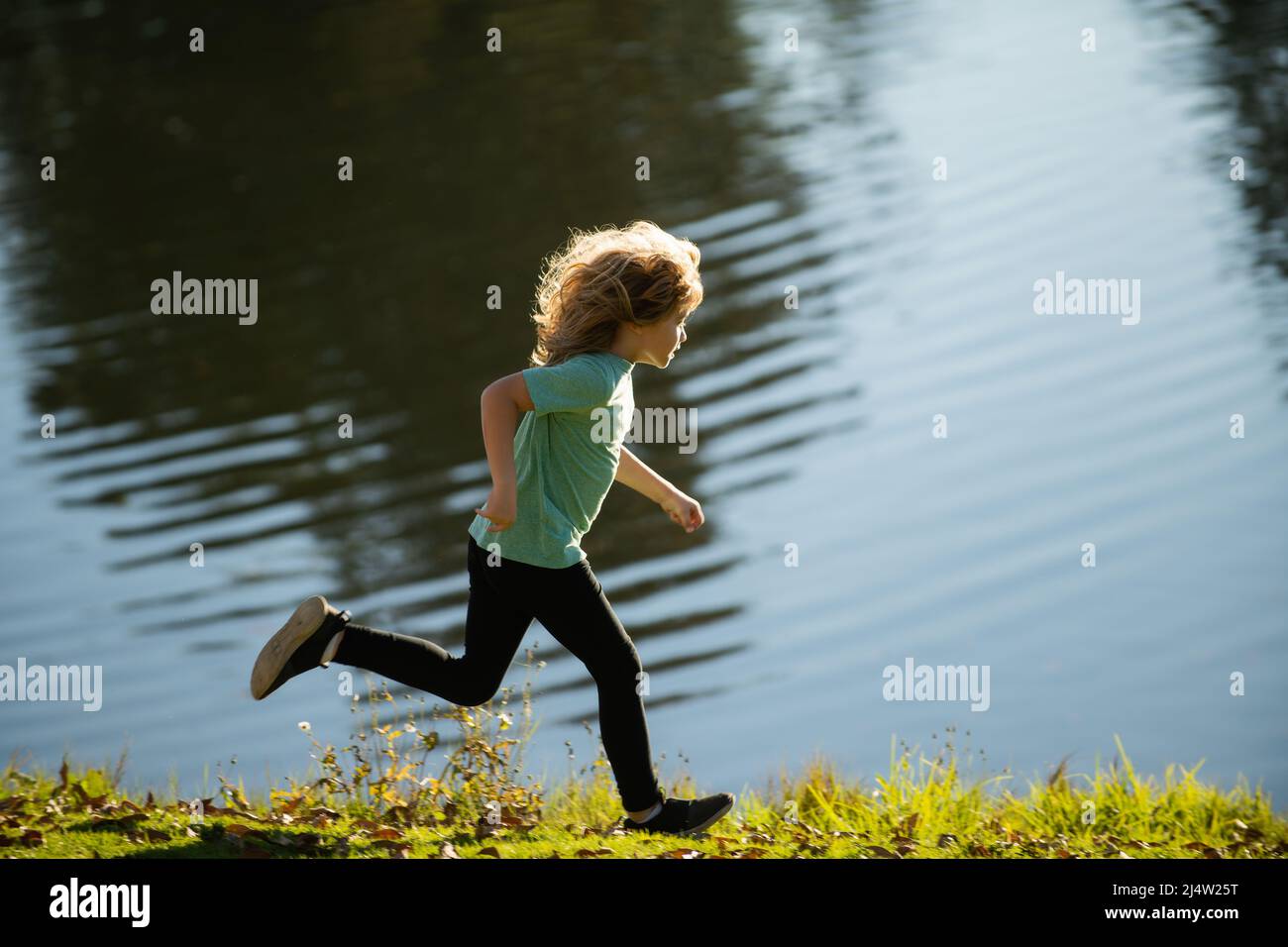 Kids playing on lake. Children play on summer family vacation. Outdoor ...