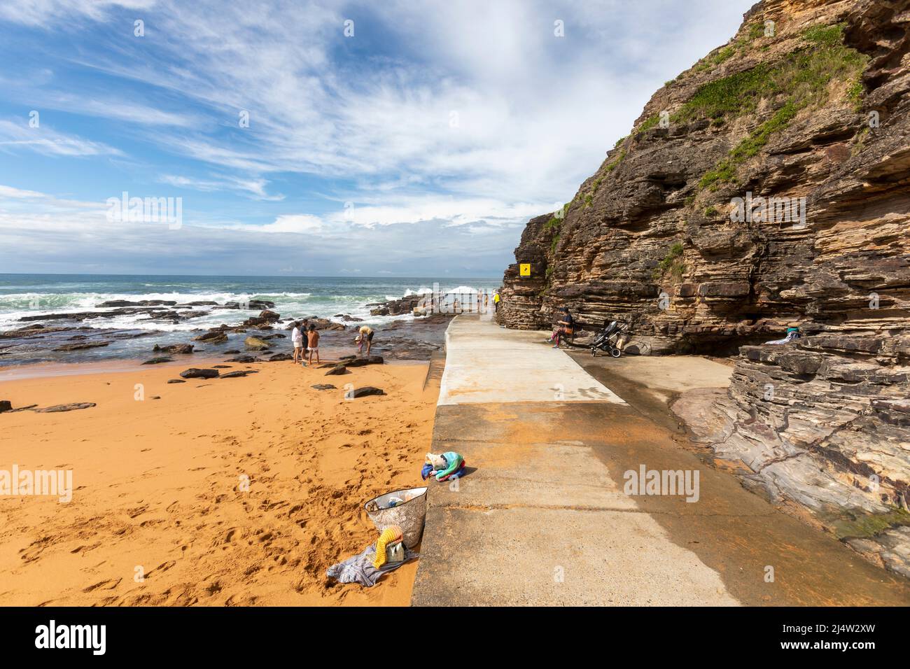 People at Avalon Beach in Sydney heading to the ocean rock swimming ...