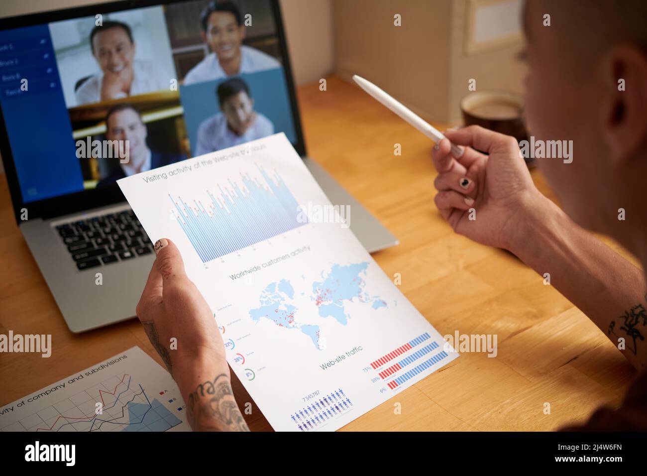 Marketing department manager holding report with charts showing ...