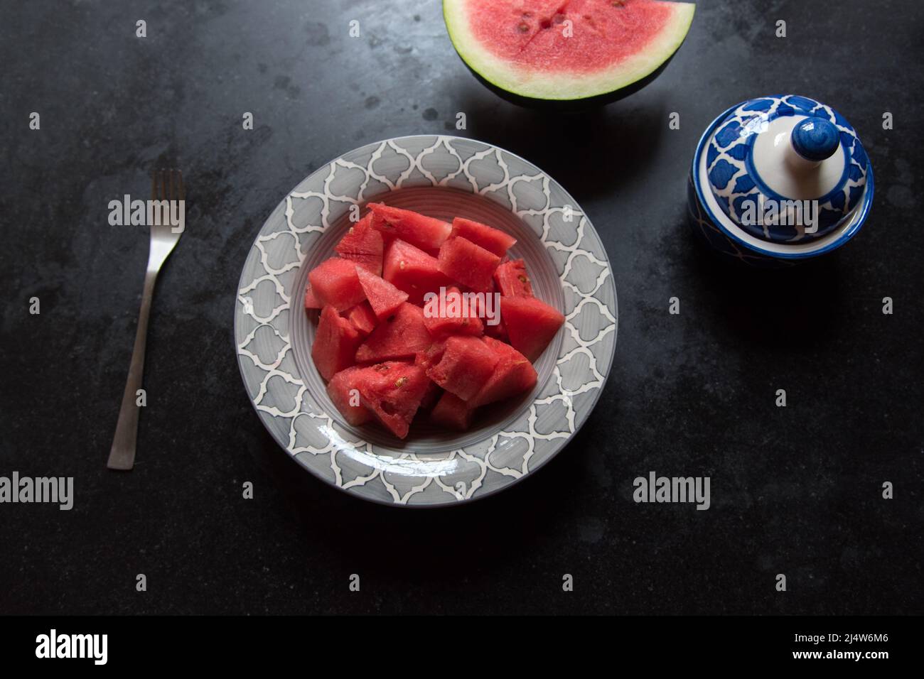 Cut fruit watermelon slices in a bowl. Top view Stock Photo - Alamy