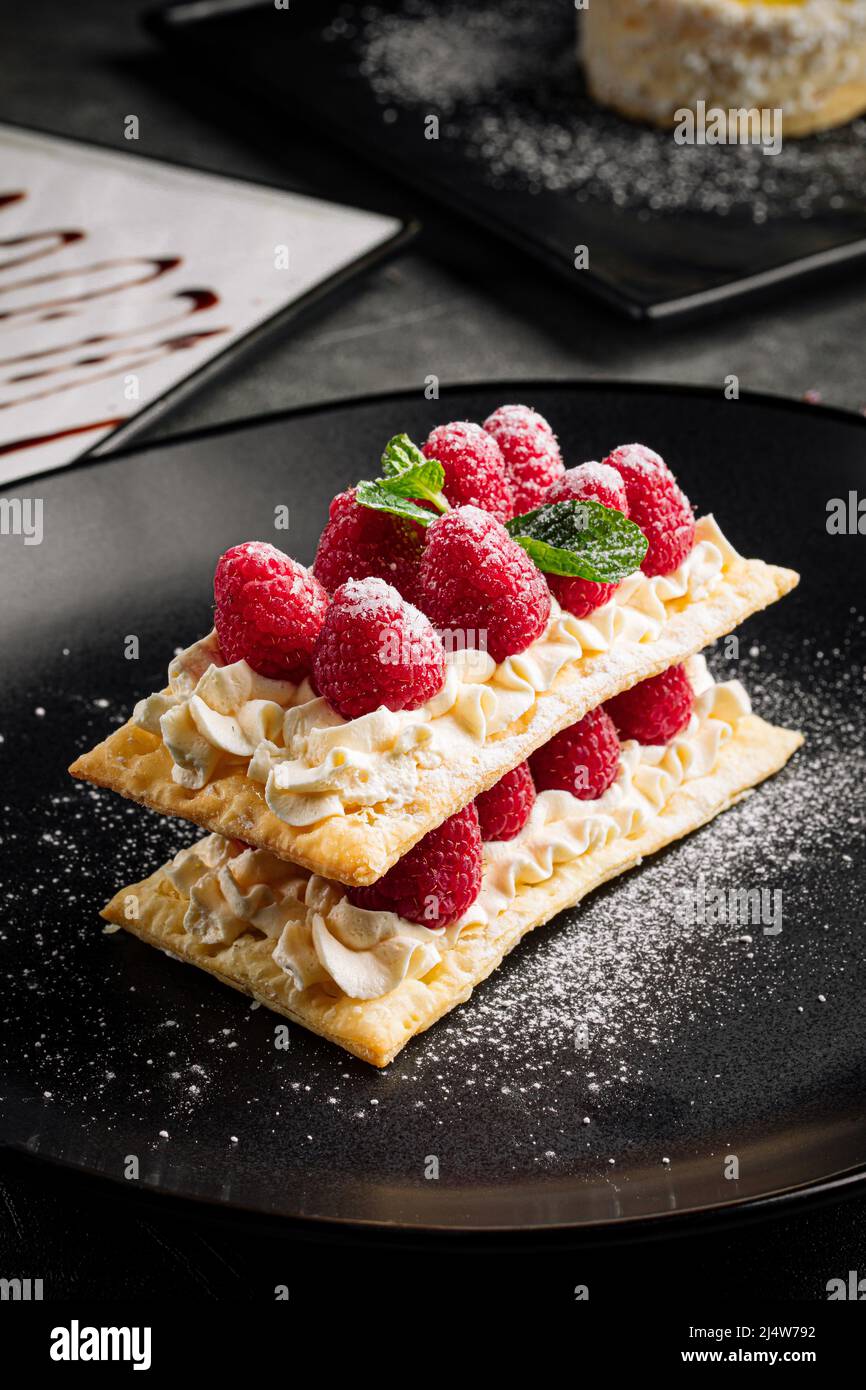 Mille feuille dessert with raspberries Stock Photo - Alamy