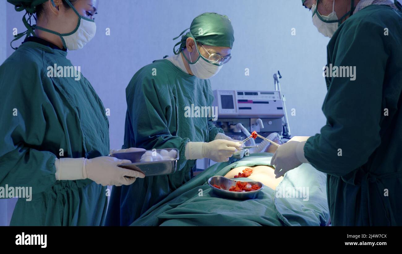 Medical surgical doctor team performing surgery patient, Group surgeon ...