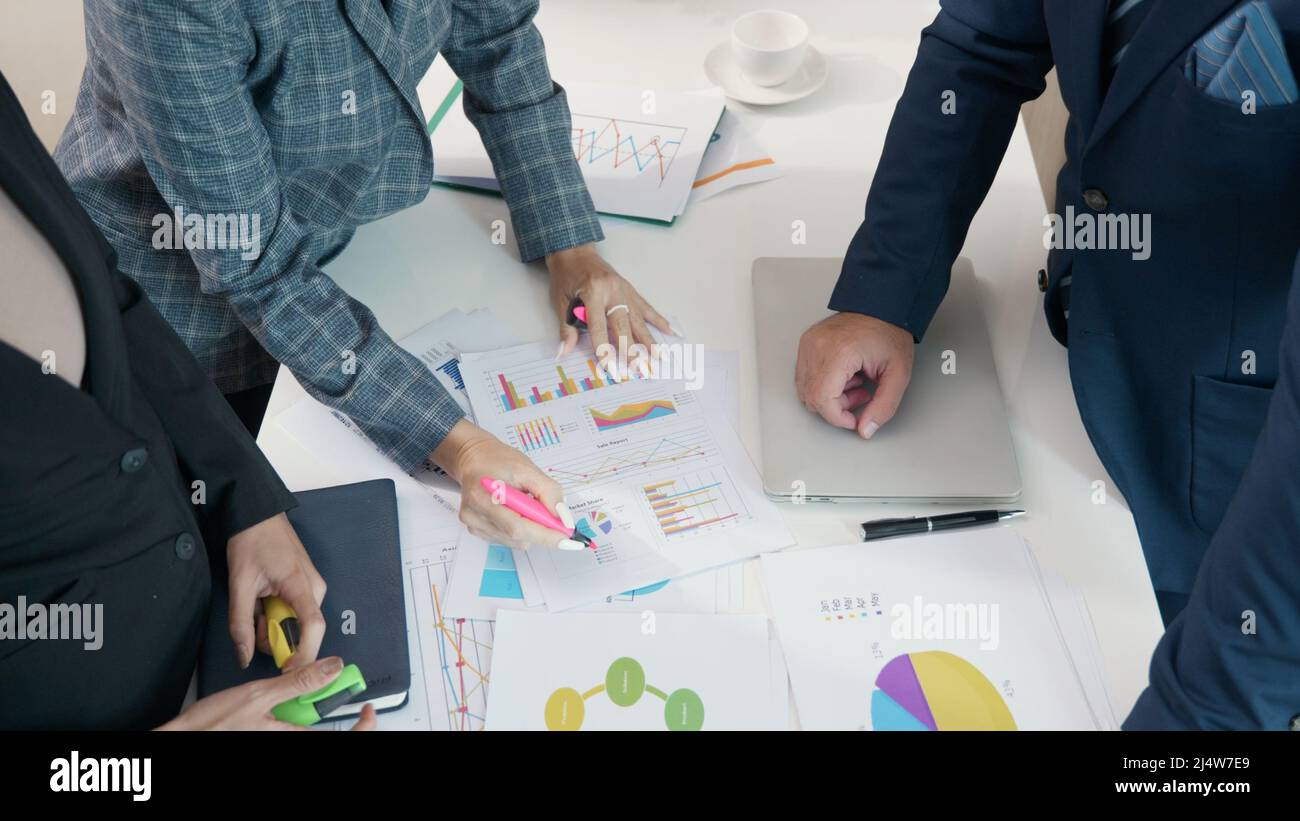 Business team meeting present briefing the project analyzing income charts graphs at office ...