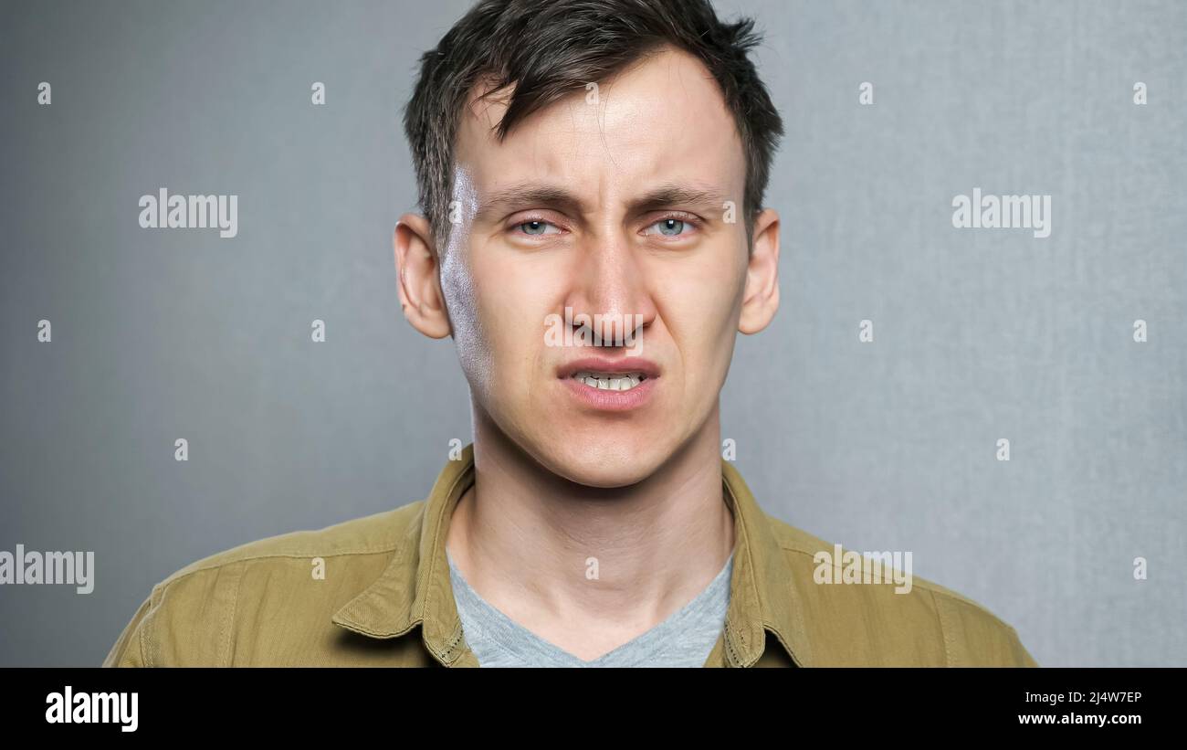 Depressed young man feels stressed and desperate Stock Photo - Alamy