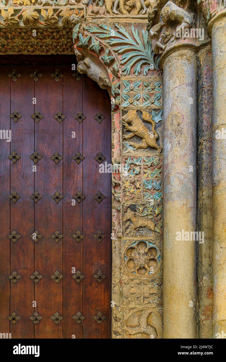 Romanesque portal decorated with ornate carvings on the facade and the ...