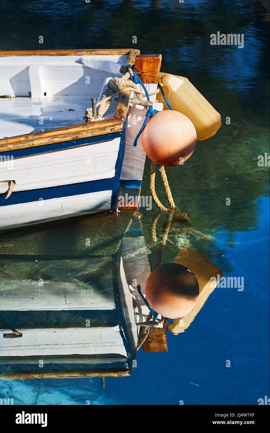 Vertical view of little boat in the water Stock Photo - Alamy