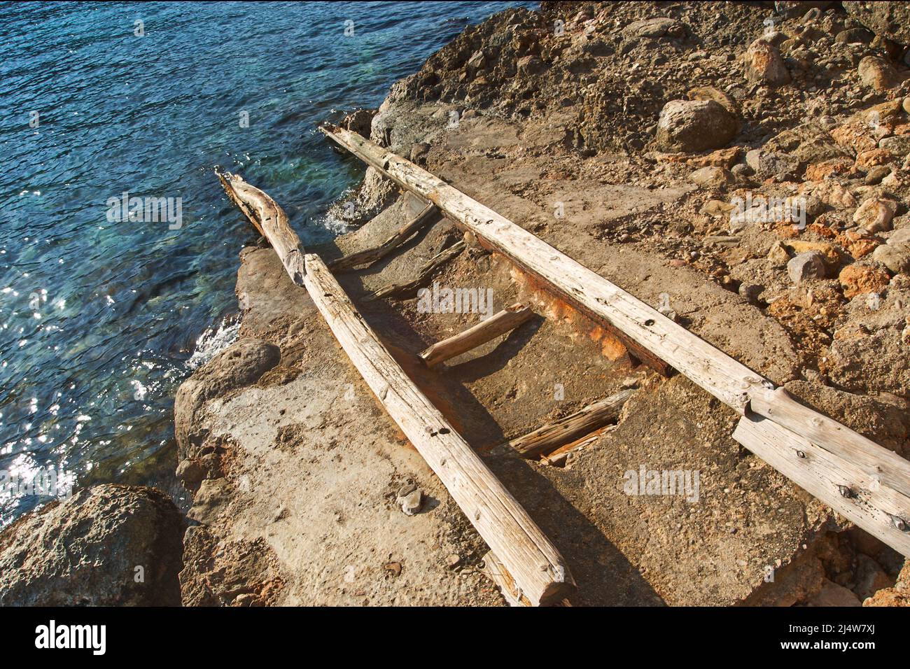 Handmade wooden ramp for small fishing boats in the Mediterranean Stock ...