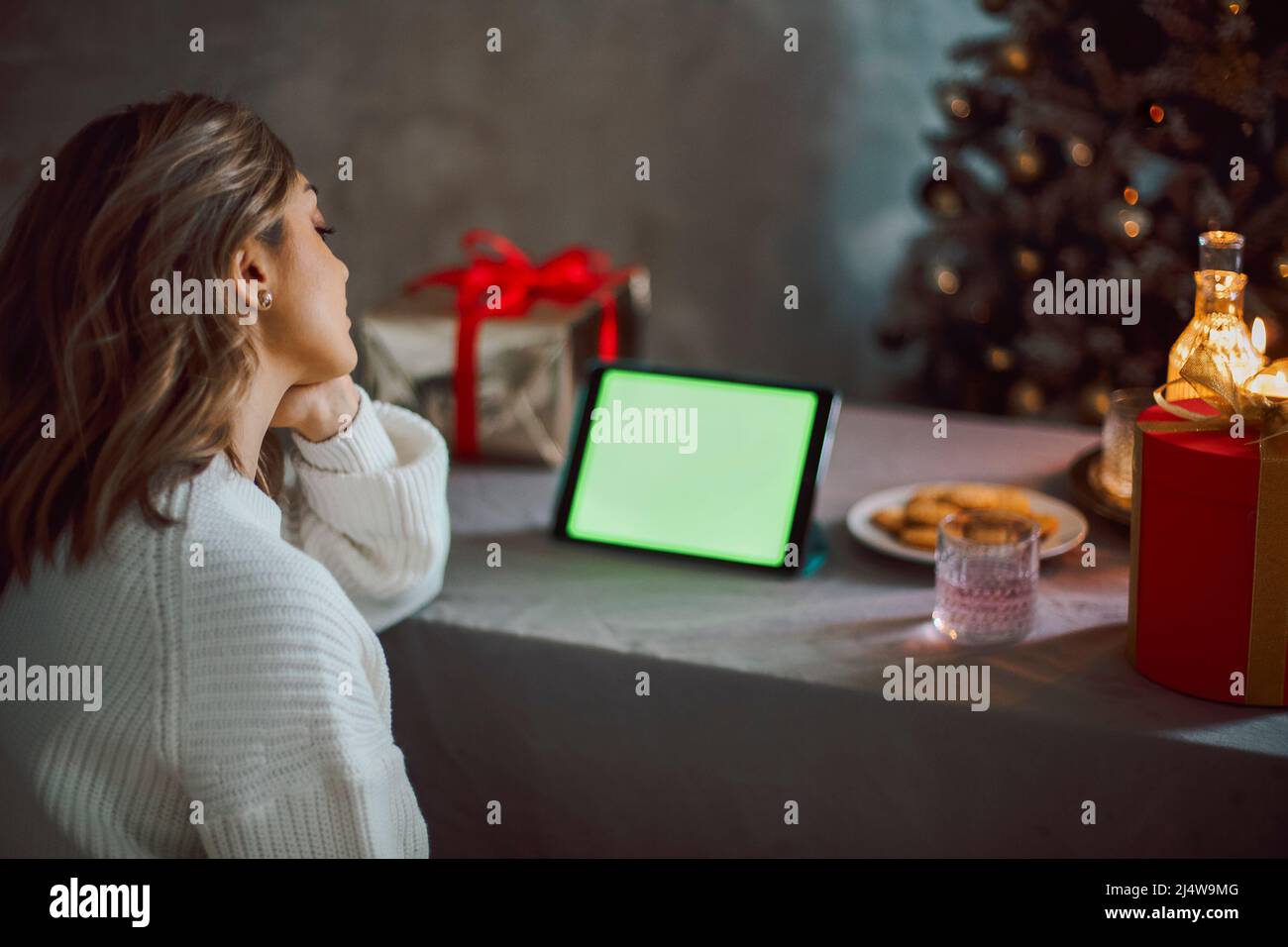 Happy young woman, drinking cocktail, talking with friends on virtual ...