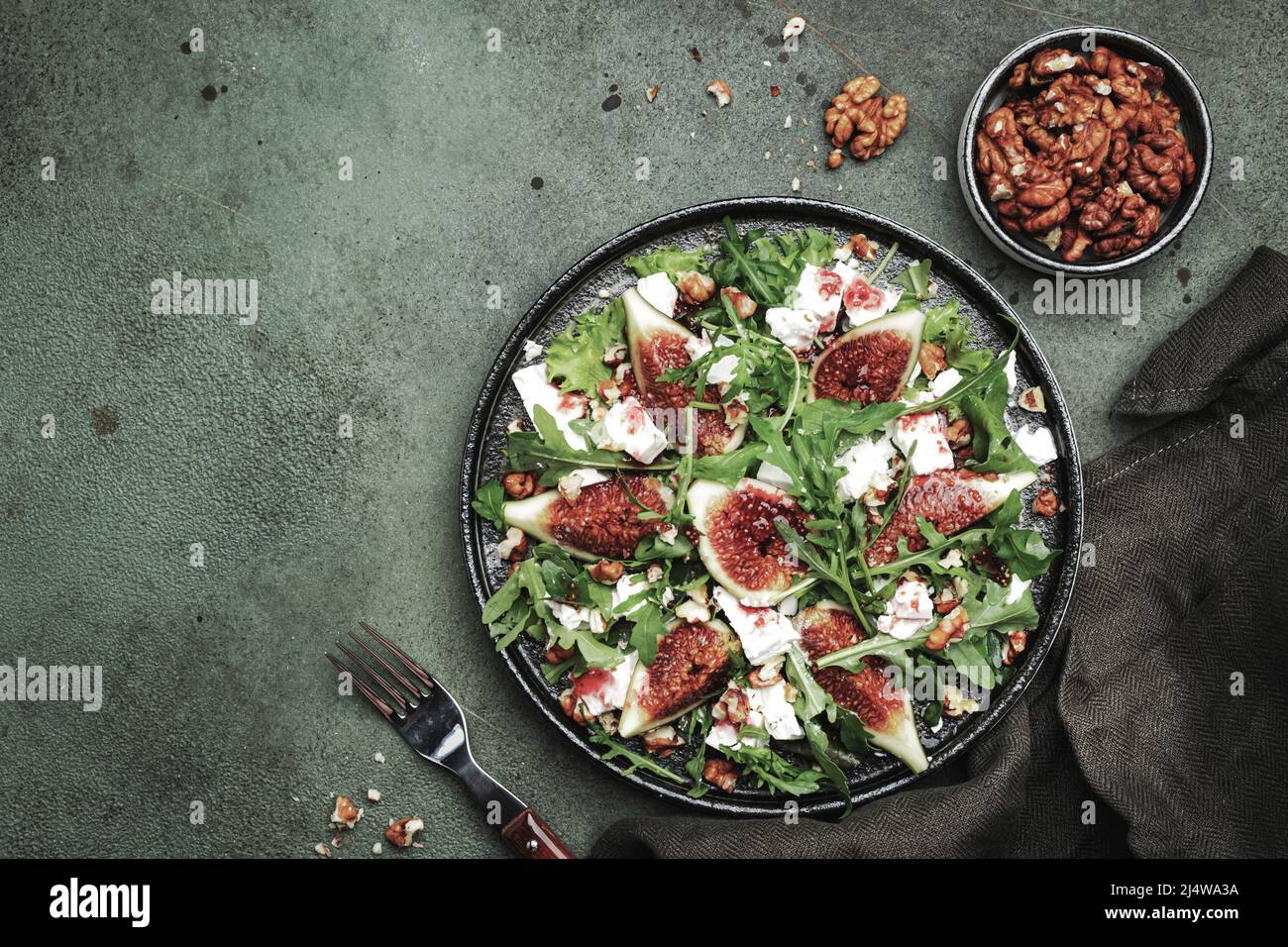 Delicious summer salad with figs, feta cheese, walnuts, arugula and ...