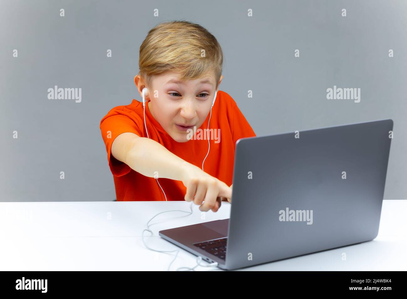 Surprised boy laptop hi-res stock photography and images - Alamy