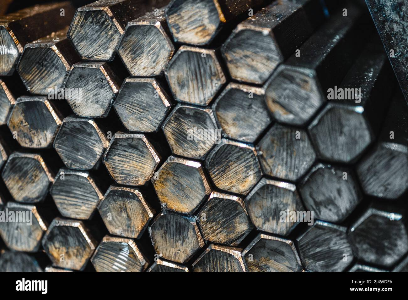 Bundle of hexagonal metal rods, hot rolled steel Stock Photo - Alamy