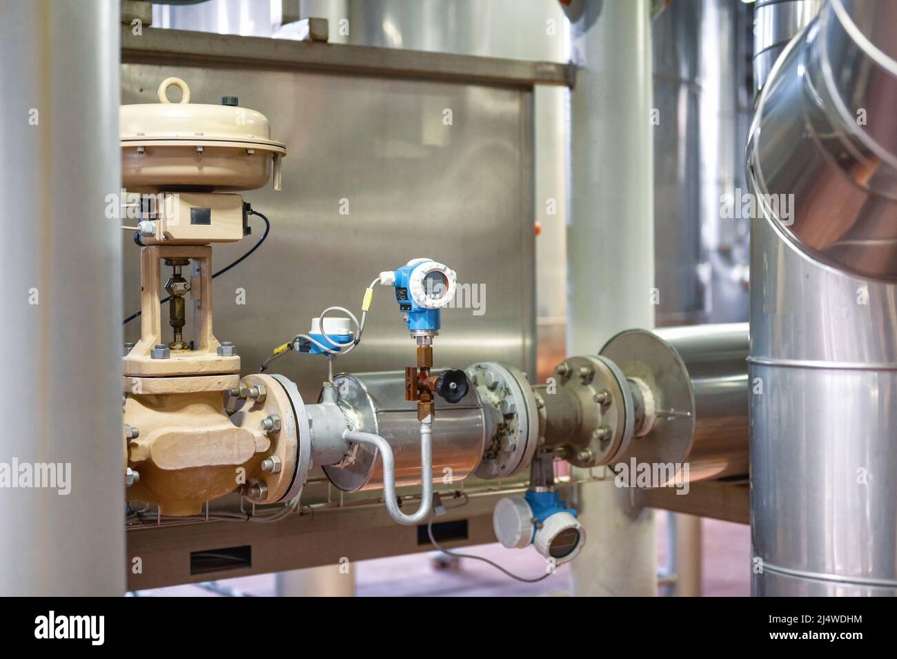 A complex and intricate system of steel pipelines, stainless insulation ...