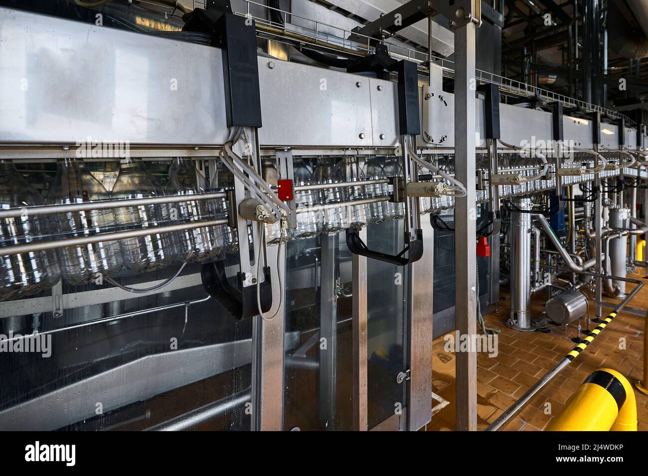 Production line with equipment of PET bottles blowing out Stock Photo ...
