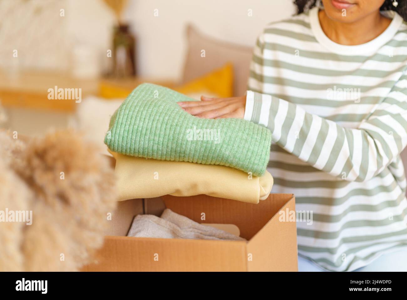 Putting away clothes hi-res stock photography and images - Alamy