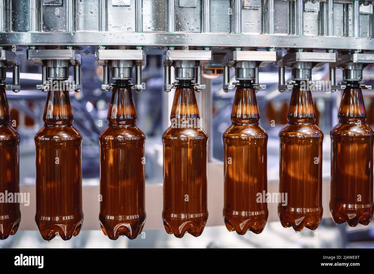 Automatic filling machine, the process of filling plastic bottles with ...