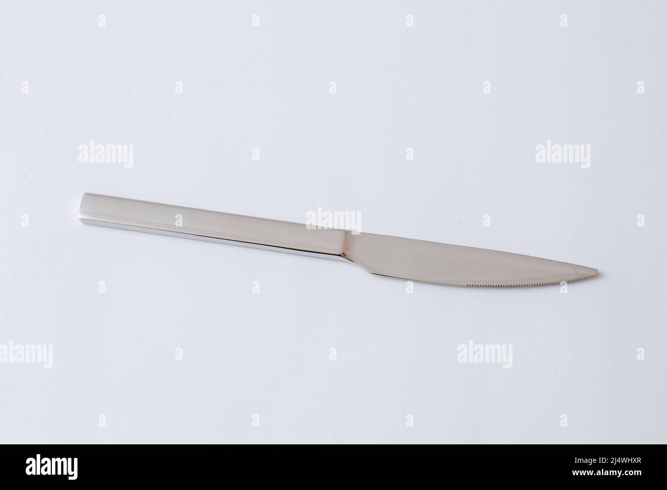 Stainless steel knife on white background, table knife Stock Photo - Alamy