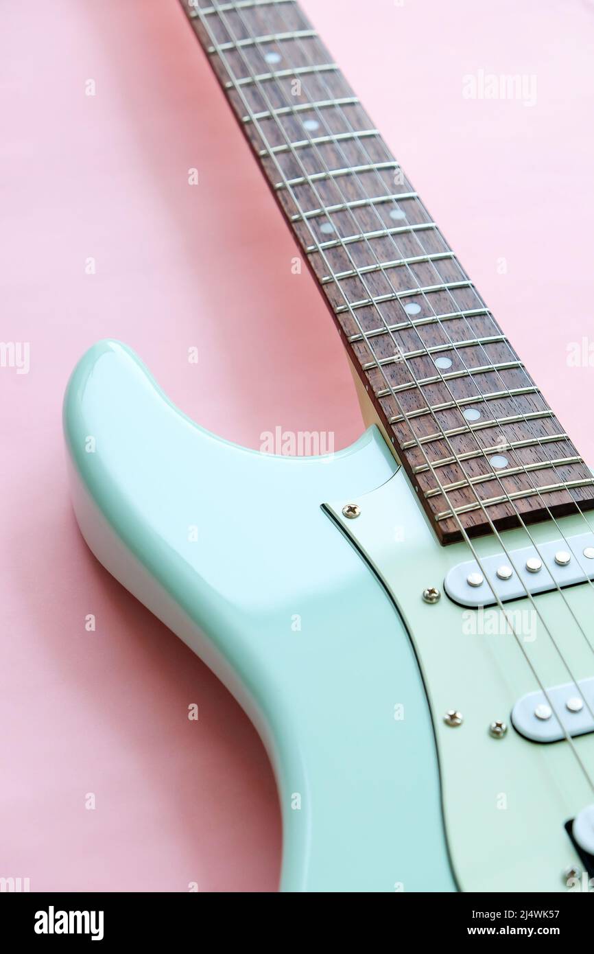 Detail of Mint Green Electric Guitar on a Pink background Stock Photo ...