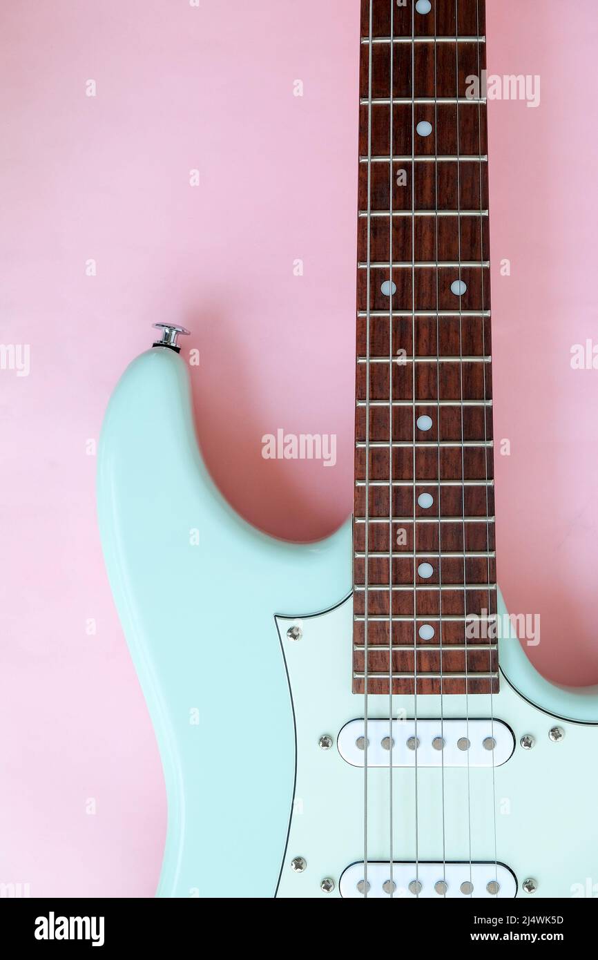 Detail of Mint Green Electric Guitar on a Pink background Stock Photo ...