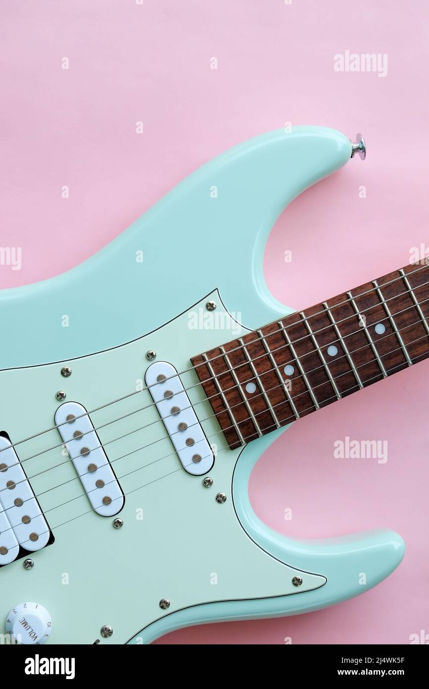 Detail of Mint Green Electric Guitar on a Pink background Stock Photo ...