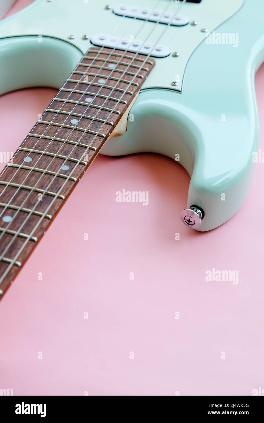 Detail of Mint Green Electric Guitar on a Pink background Stock Photo ...