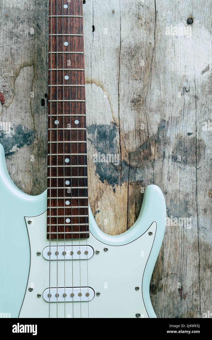 Detail of Mint Green Electric Guitar on a wood background Stock Photo ...