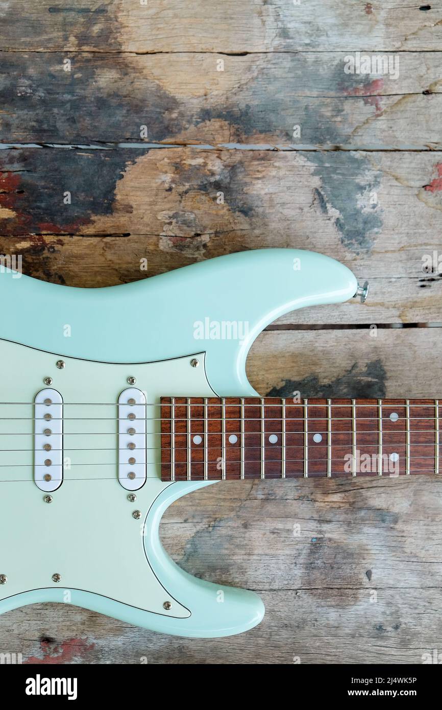 Detail of Mint Green Electric Guitar on a wood background Stock Photo ...