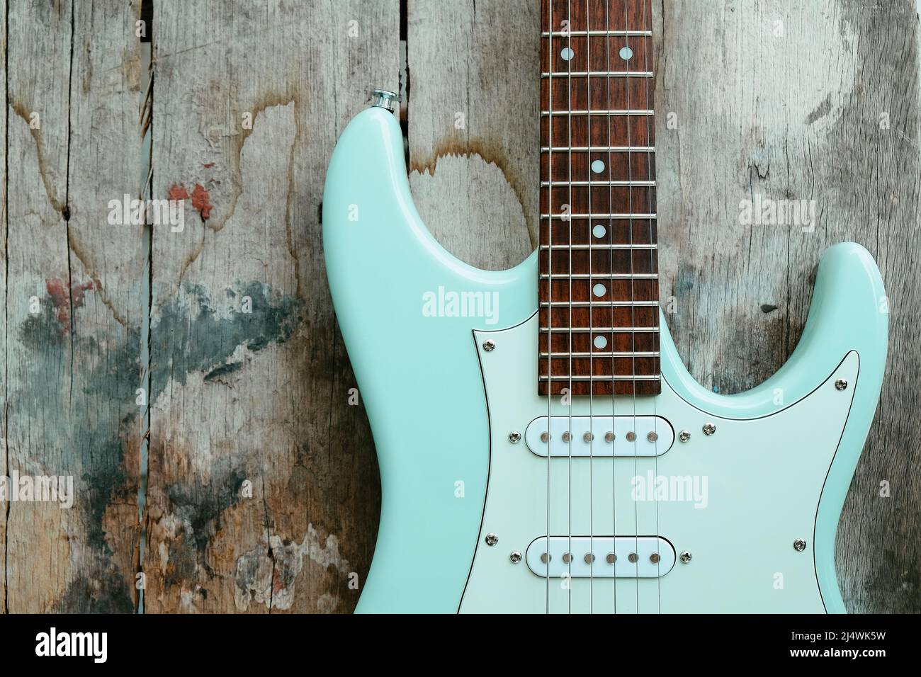 Detail of Mint Green Electric Guitar on a wood background Stock Photo ...
