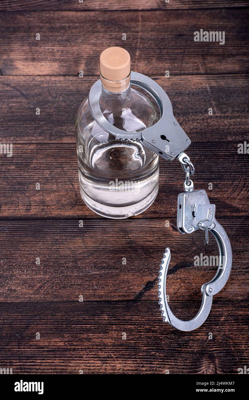 The concept of liberation from alcohol addiction, a bottle of alcohol ...