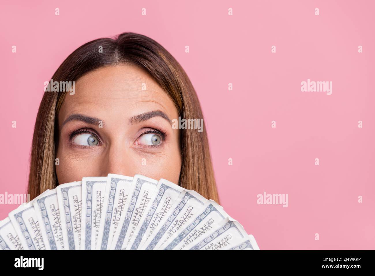Photo of young woman wonder guess think look empty space close mouth ...