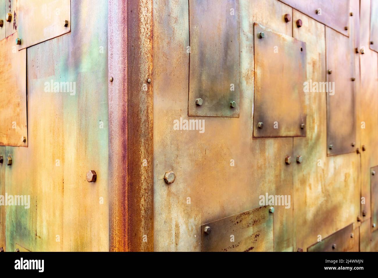 Background with metallic multicolored old coating with patches and ...