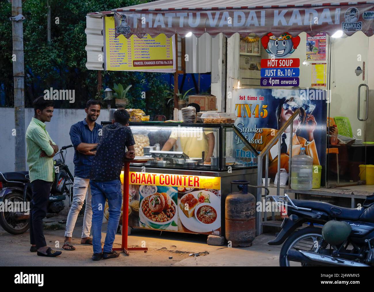 Men standing in front of a street food shop in Trichy, Tamil Nadu ...