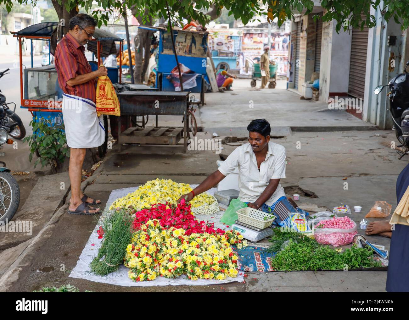 Asian man selling flowers hi-res stock photography and images - Alamy