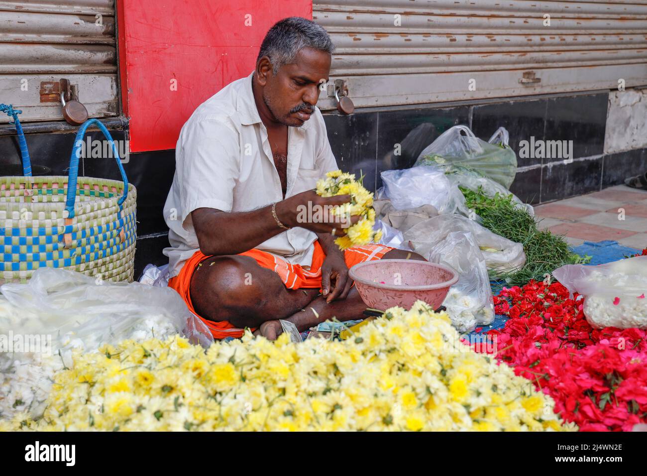 Asian man selling flowers hi-res stock photography and images - Alamy