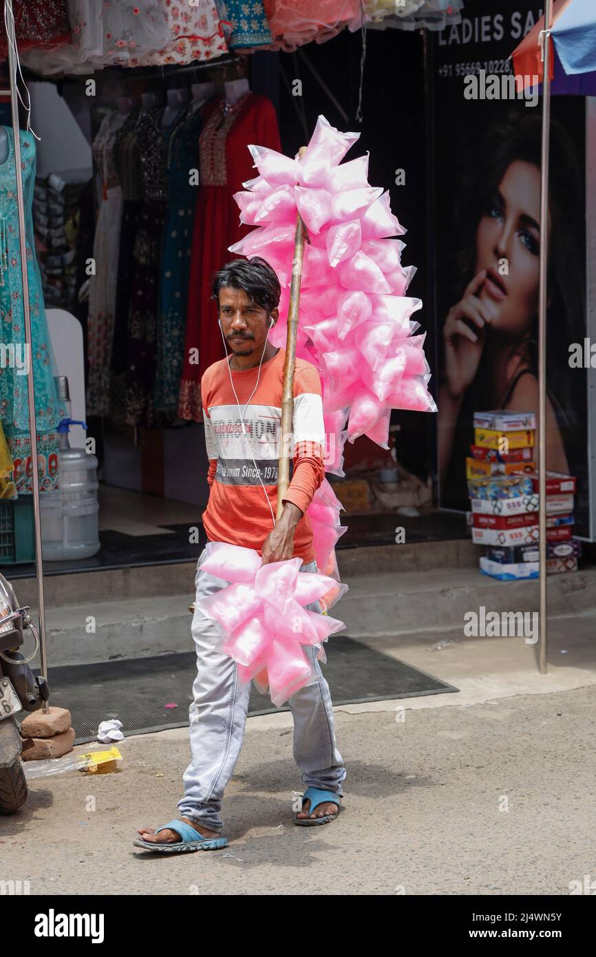 A young man walking the street selling cotton candy in Trichy, Tamil ...